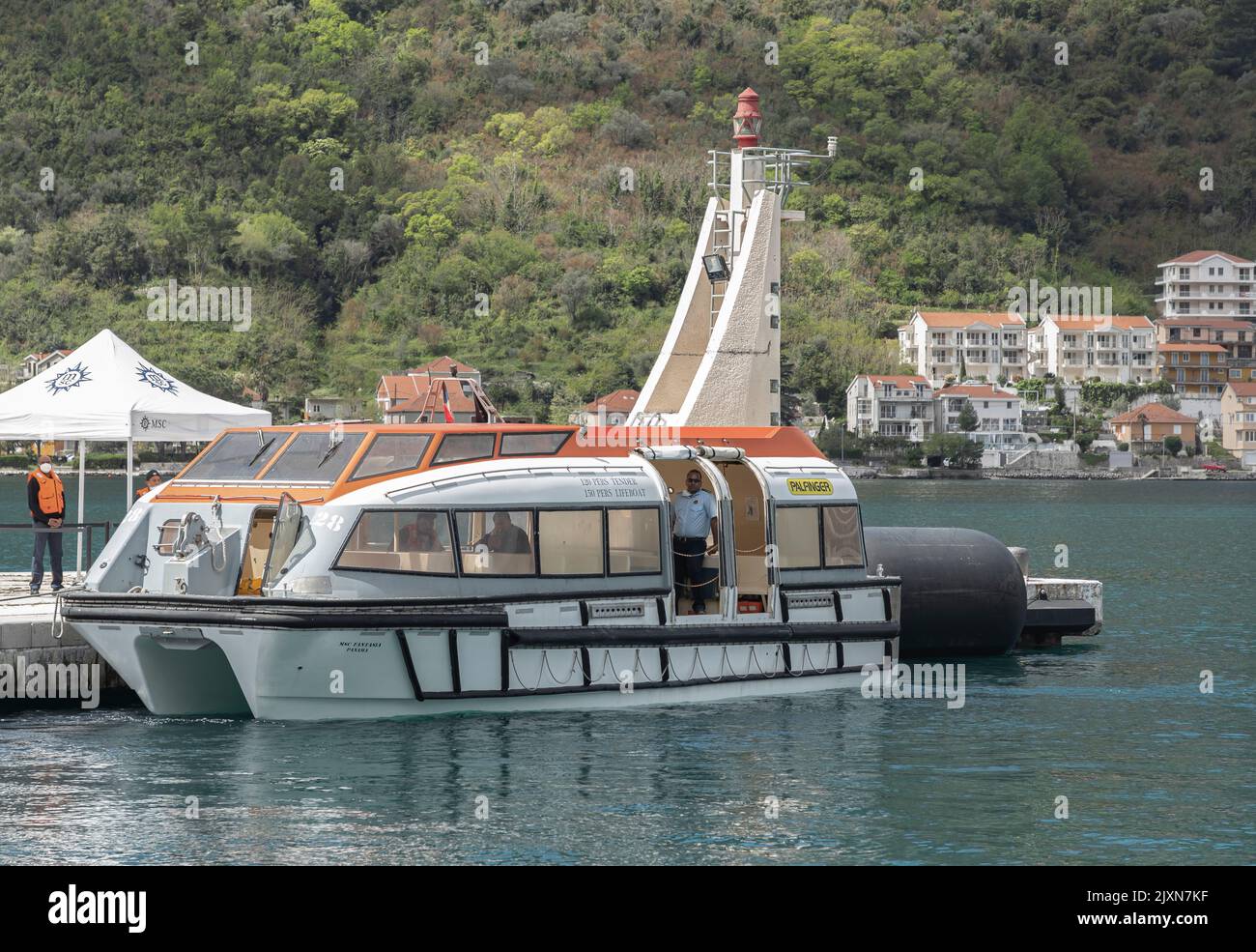 Landing craft from a luxury liner docking in the bay of LKotor to allow ...
