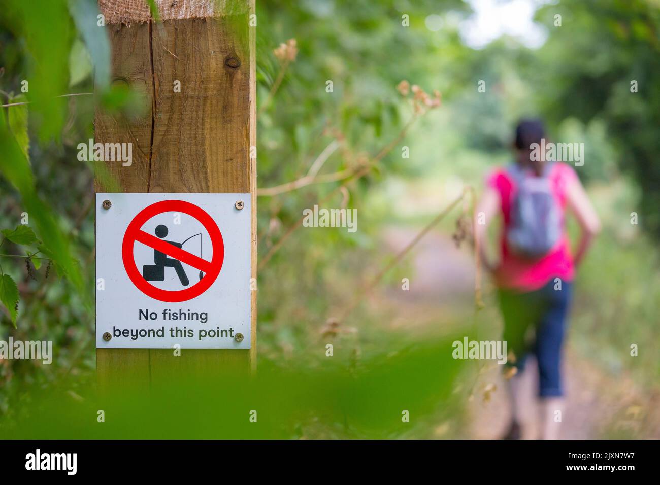 Close up of sign: 'No Fishing Beyond This Point' on a UK canal towpath ...