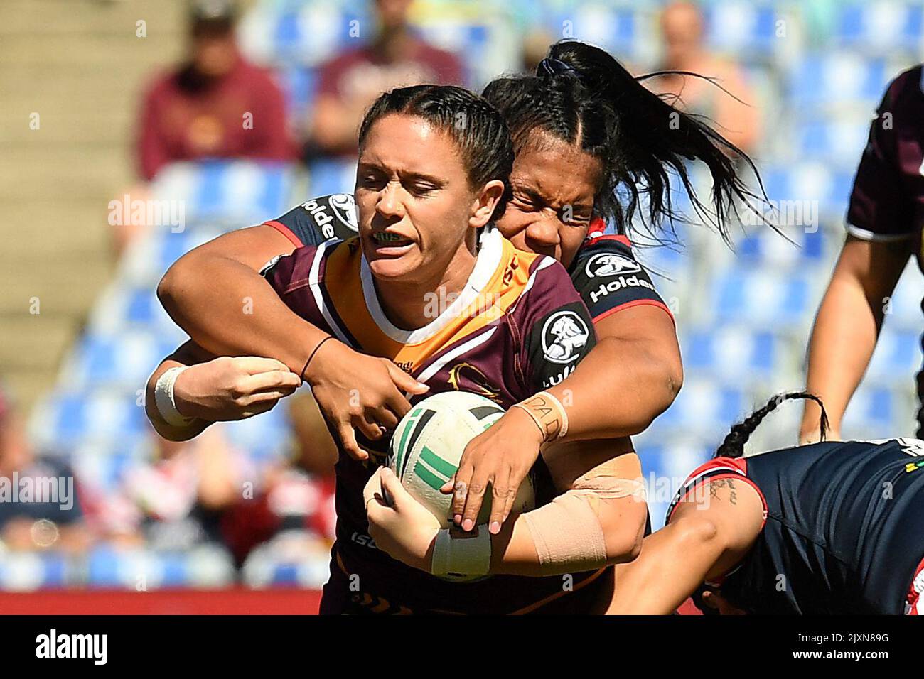 Simaima Taufa of the Roosters tackles Brittany Breayley of the Broncos ...