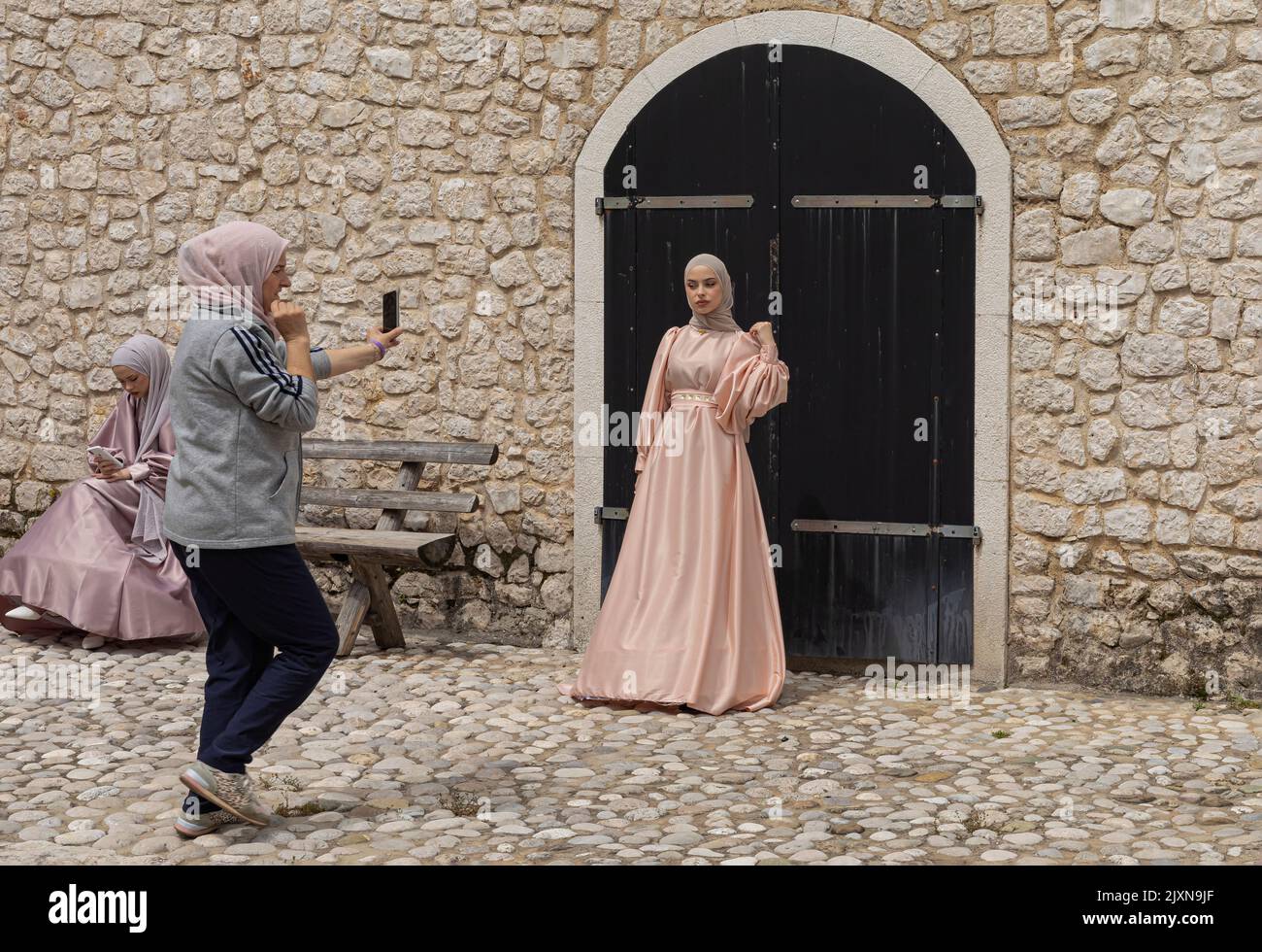 Two beautiful Muslim young ladies having a photoshoot Stock Photo - Alamy