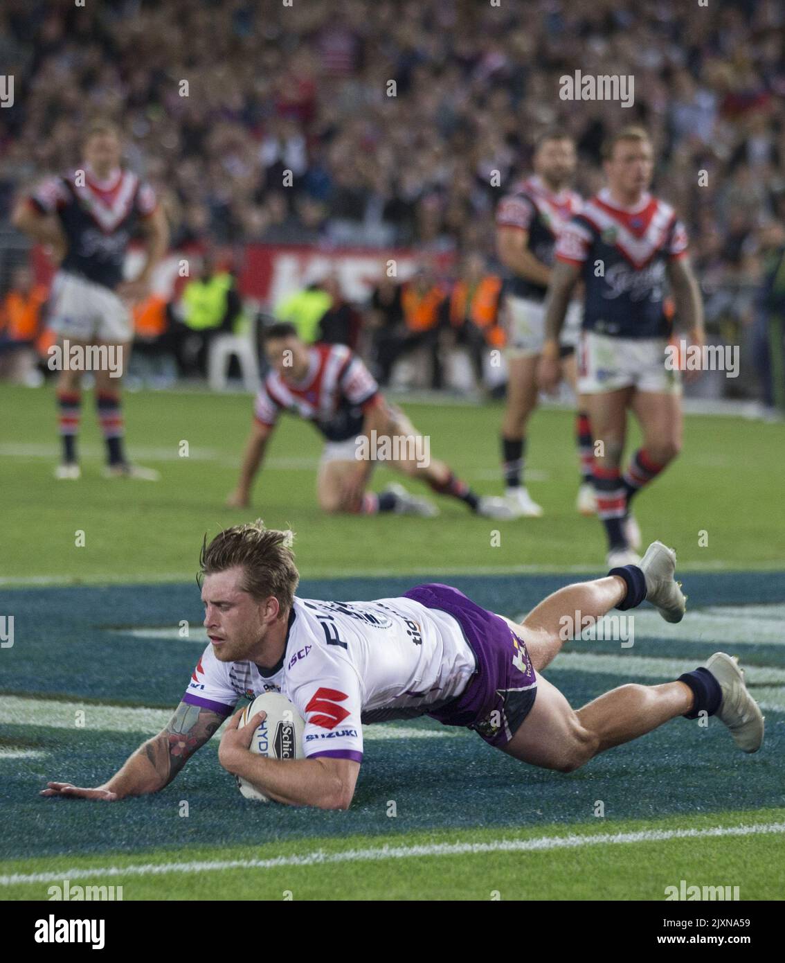 Cameron Munster of the Storm crosses the Sydney Roosters line but try ...