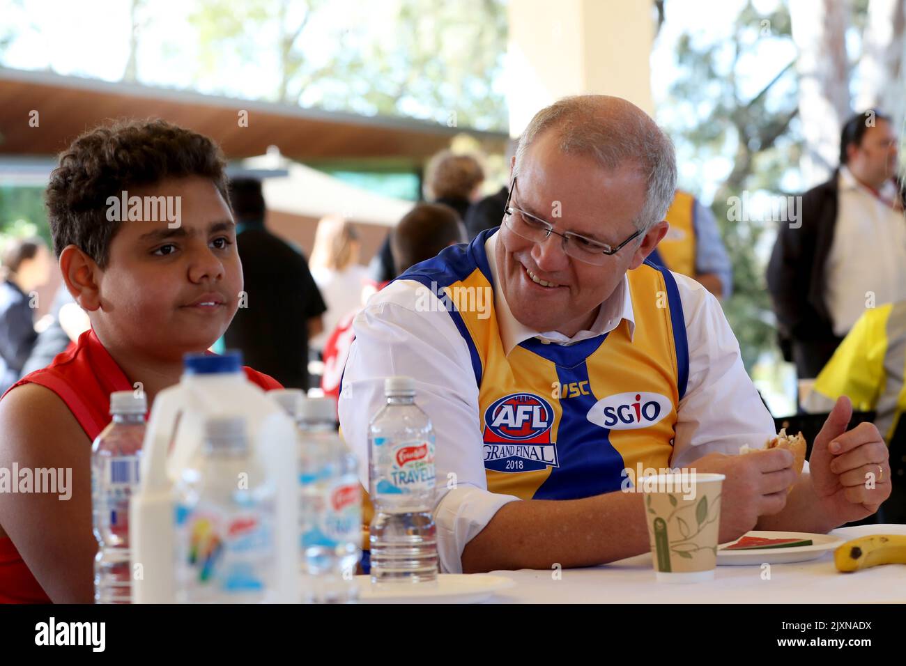 Prime Minister Scott Morrison talks to students over breakfast during a ...