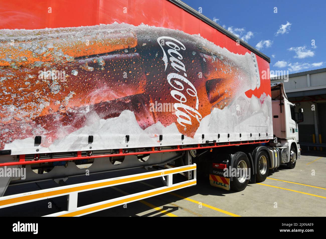 A Coca-Cola advertisement is seen on the side of a truck at Coca Cola ...