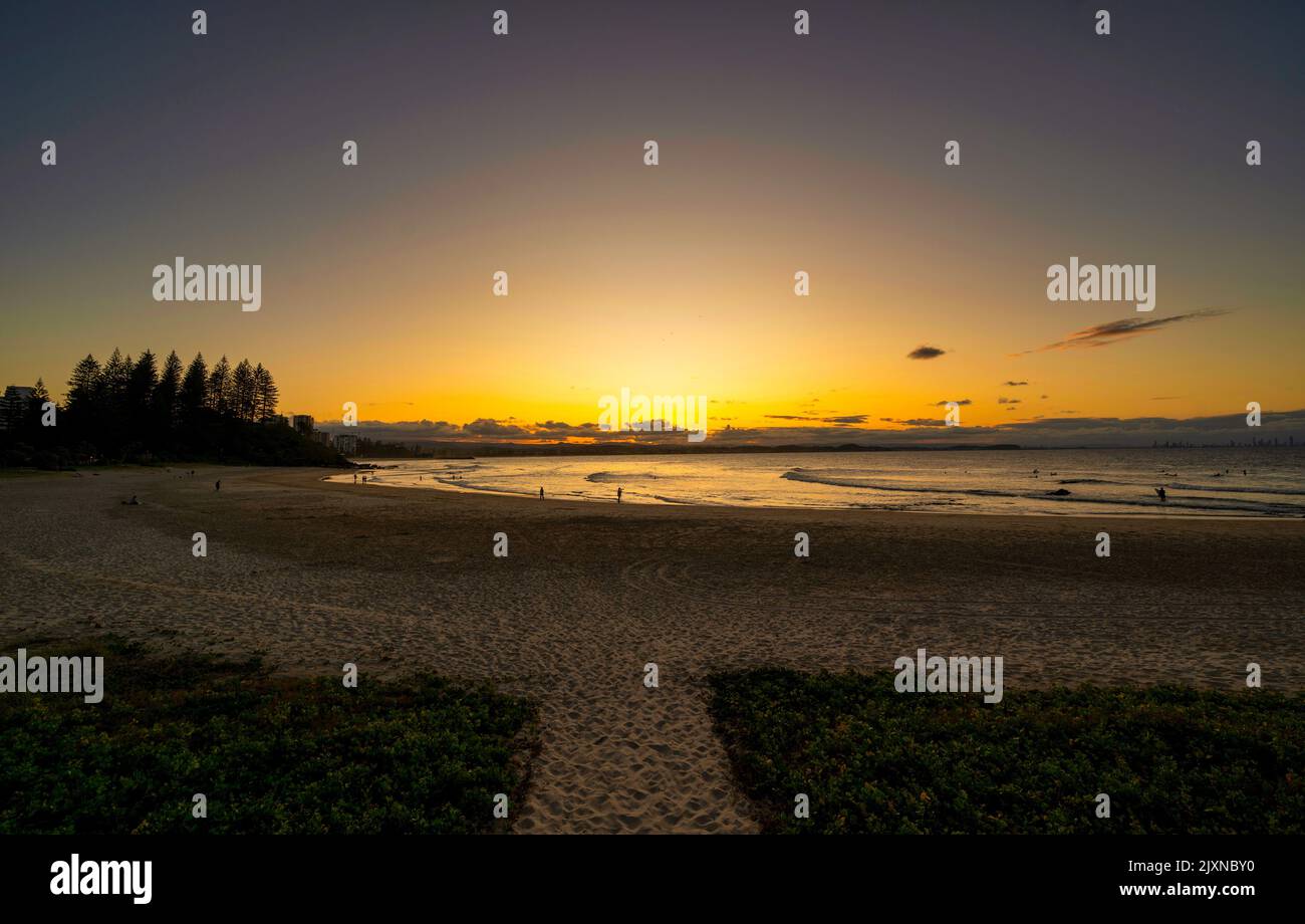A beautiful view of Snapper Rocks with bright orange sunset Stock Photo ...