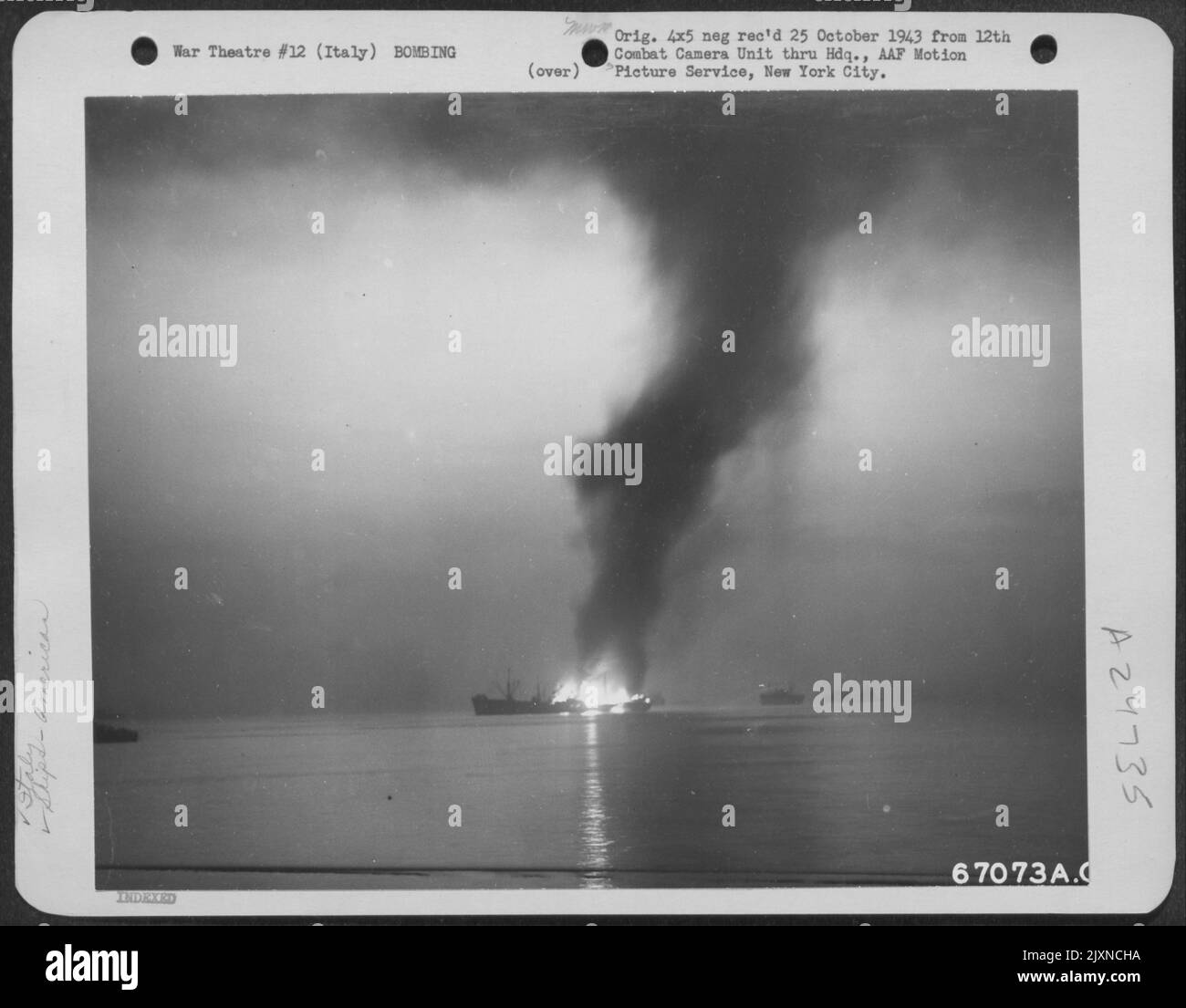 A Column Of Black Smoke Rises From A Freighter Which Is Burning ...