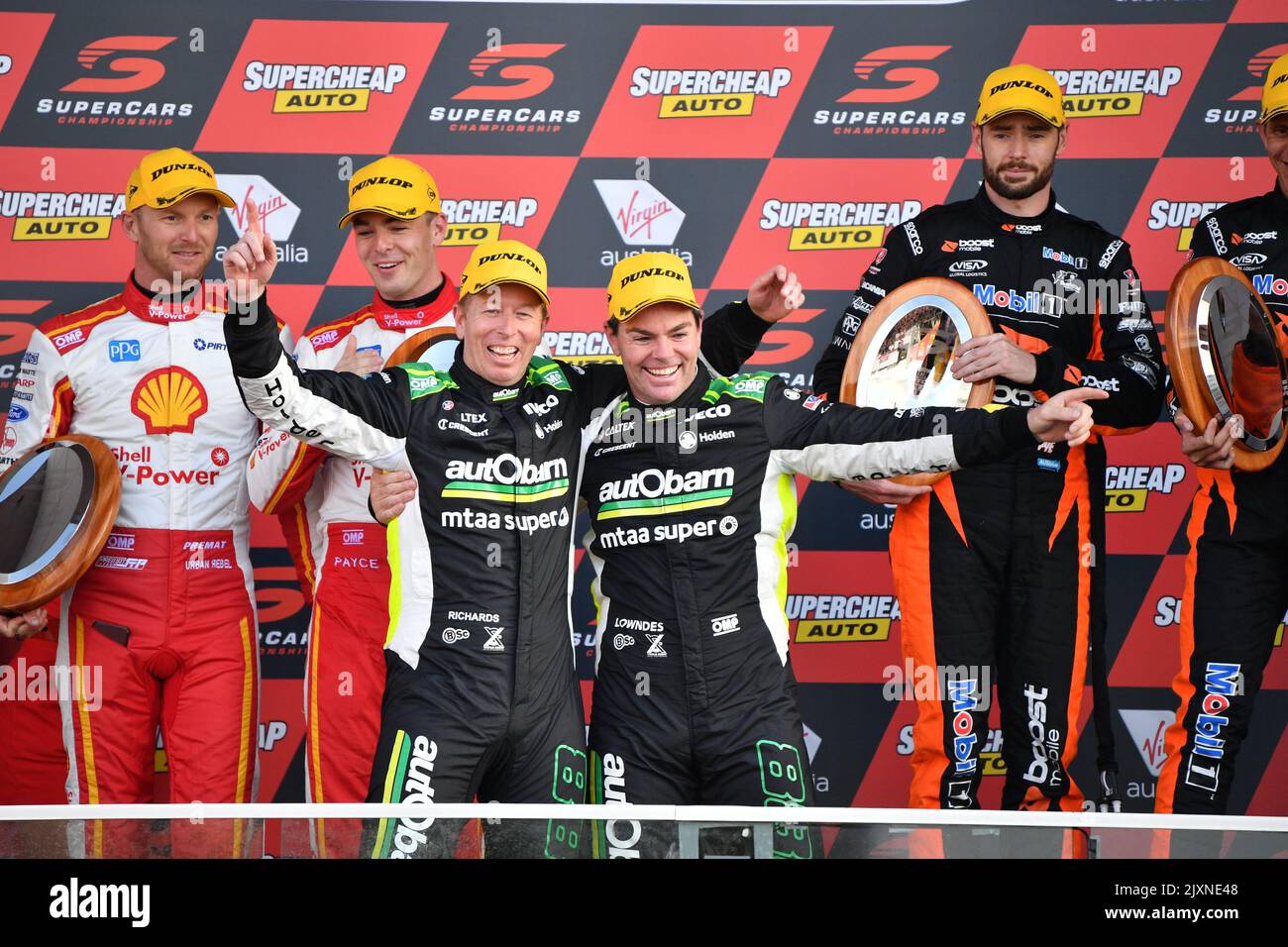 Craig Lowndes (front right) and Steven Richards of Autobarn Lowndes ...
