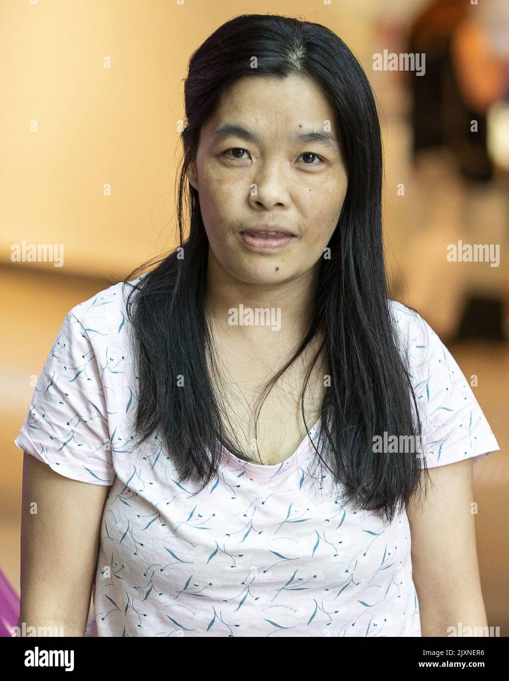 Bhumchu Zangmo, the mother of conjoined twins Nima and Dawa, arrives to ...