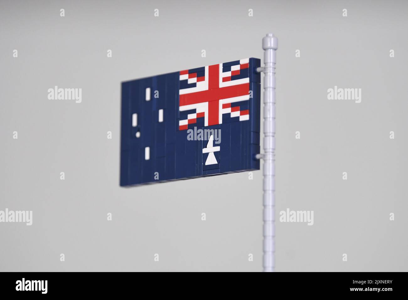 The Australian flag is seen in a model of Parliament House made from ...