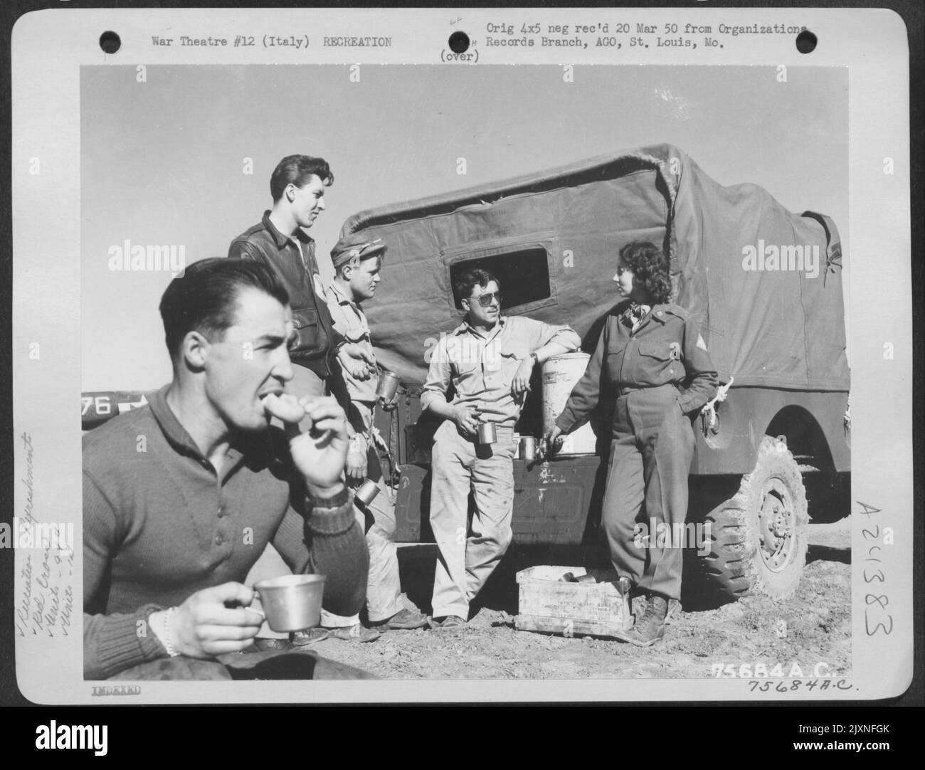 A Red Cross Worker Services Doughnuts And Coffee To Personnel Of The ...