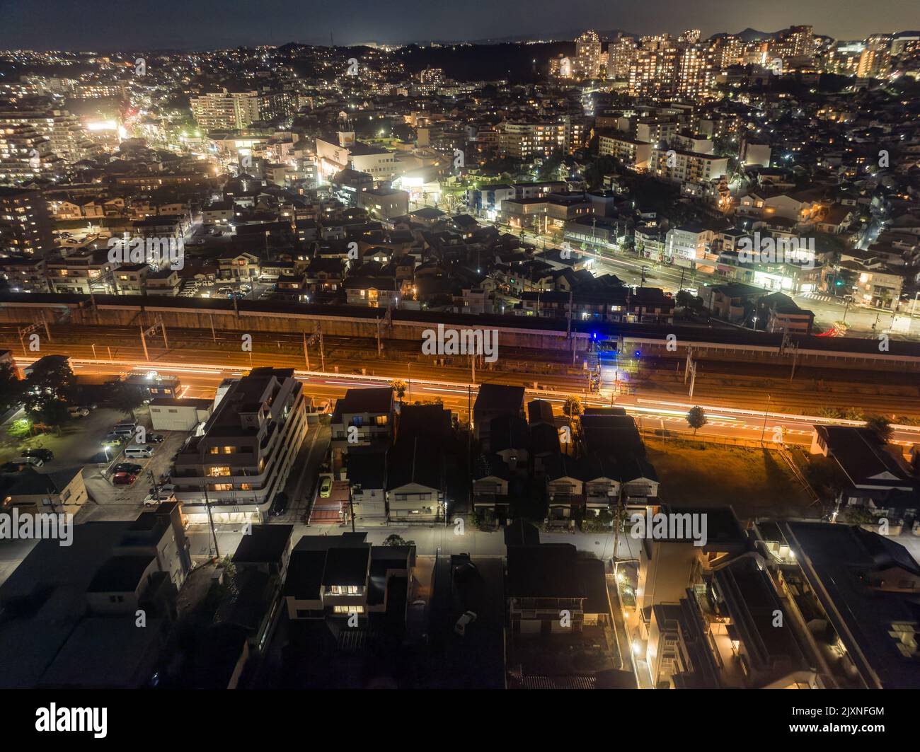 Aerial view of traffic on busy roads through small town at night Stock ...