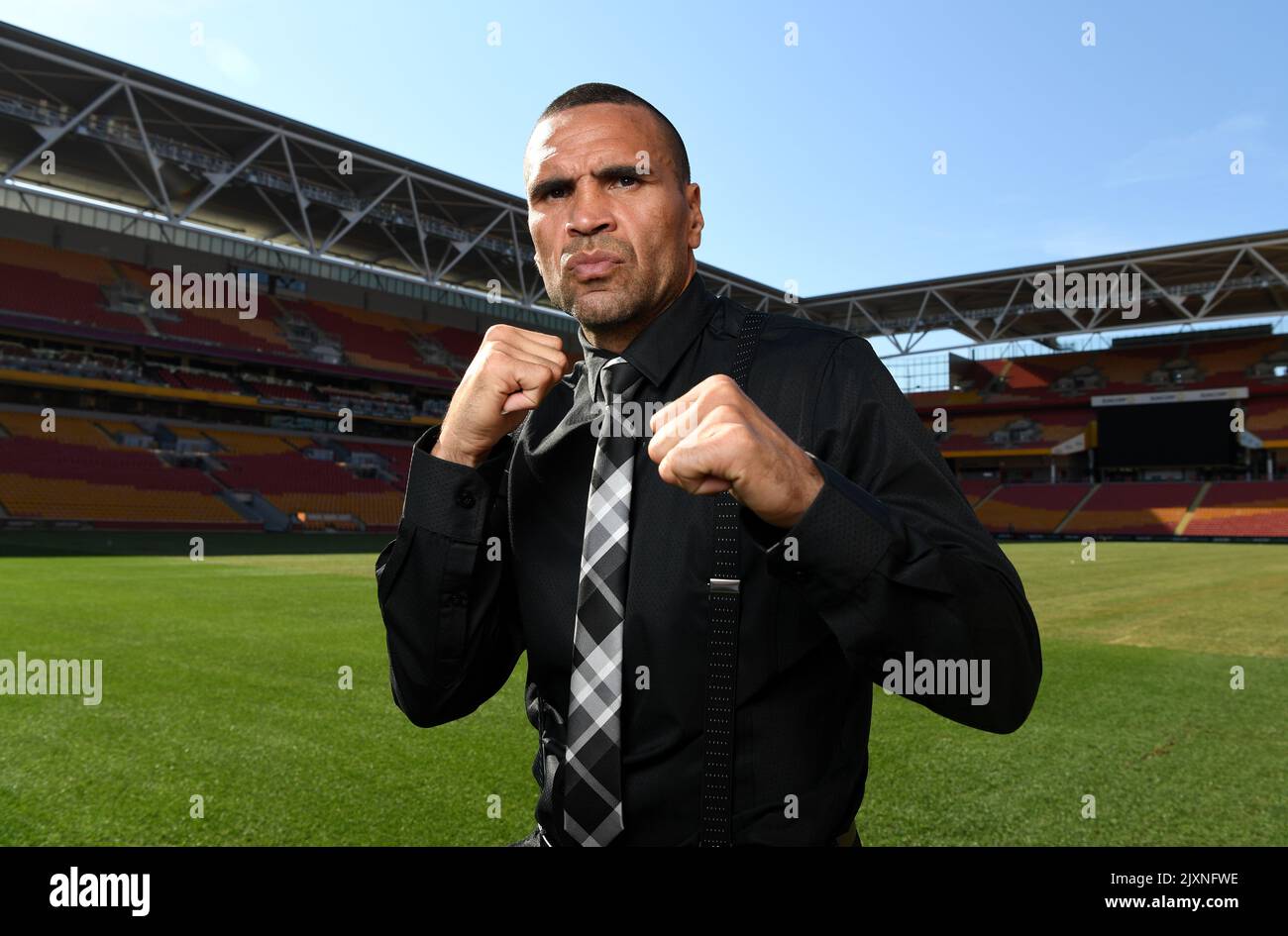 Australian boxer Anthony Mundine poses for photos after a press ...