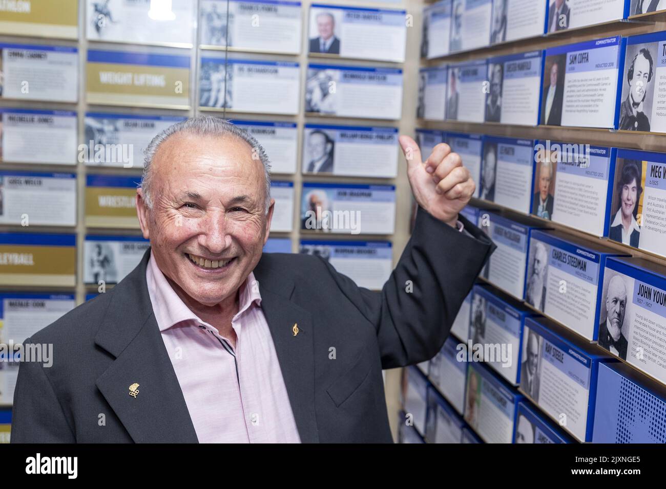 Sam Coffa poses for a photograph with his plaque during the 2018 Sport ...