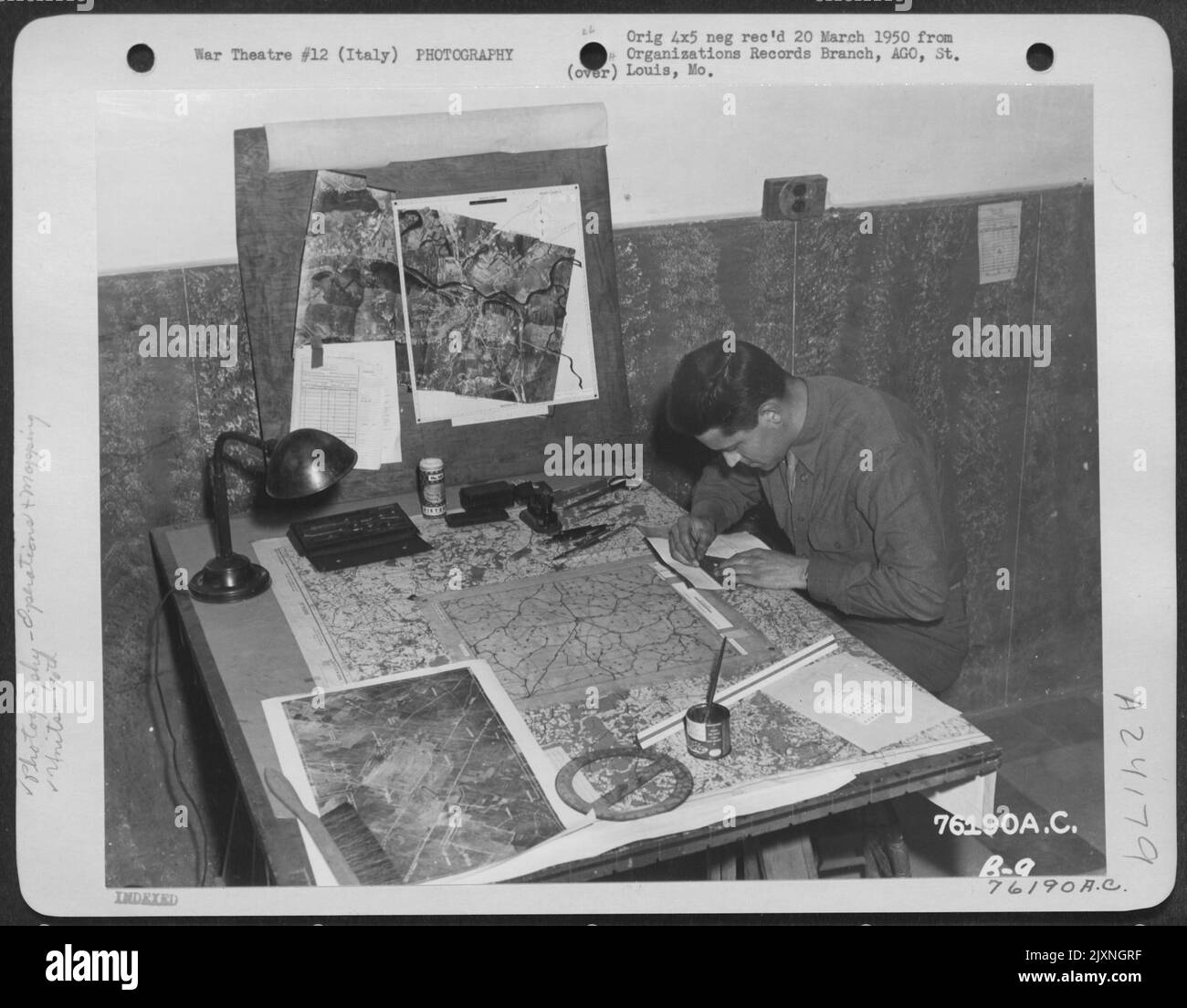An Engineer Of The 90Th Photo Reconn Wing Works On A Map At An Air Base ...