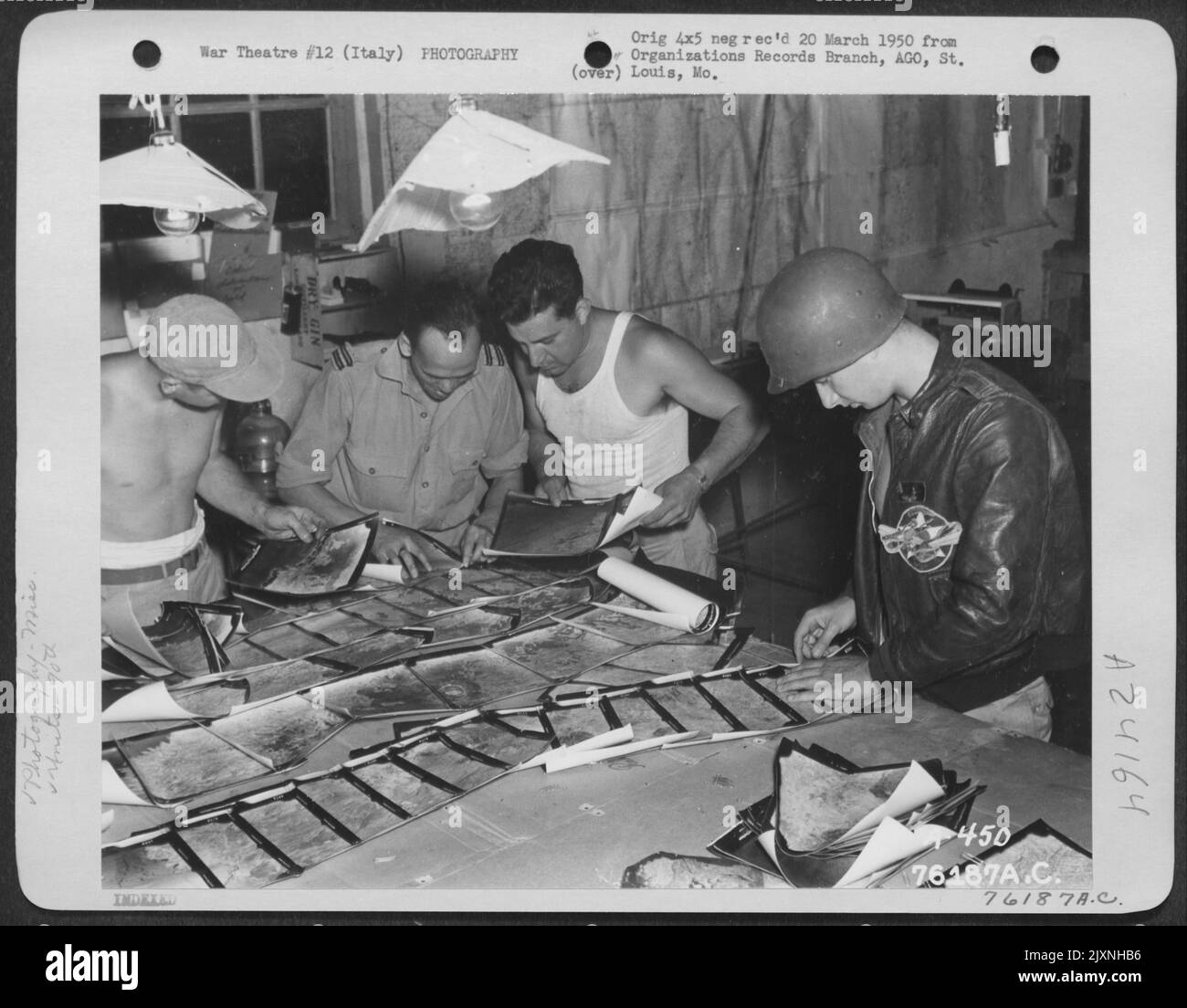 A Pilot Of The 90Th Phoot Reconn Wing Checks Photos Of A Completed ...