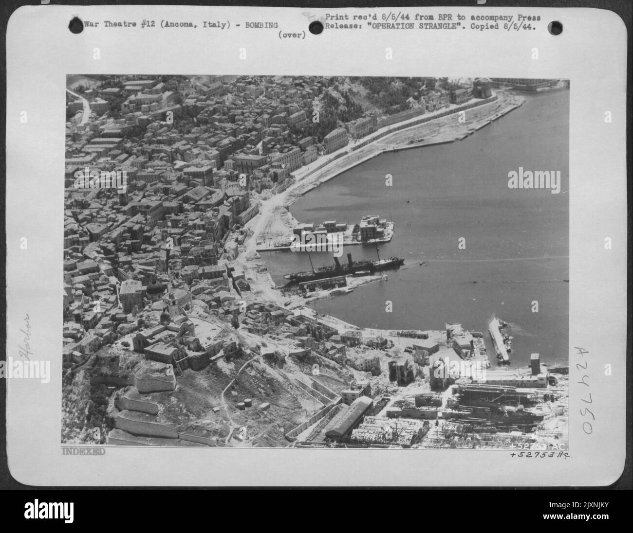 This general view of Ancona Harbor, Italy shows the bomb damage on port ...