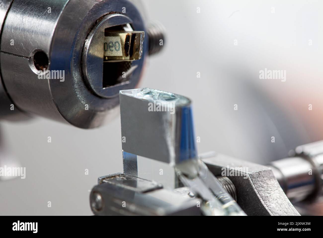 Closeup of an epoxy embedded tissue placed on the ultramicrotome to ...
