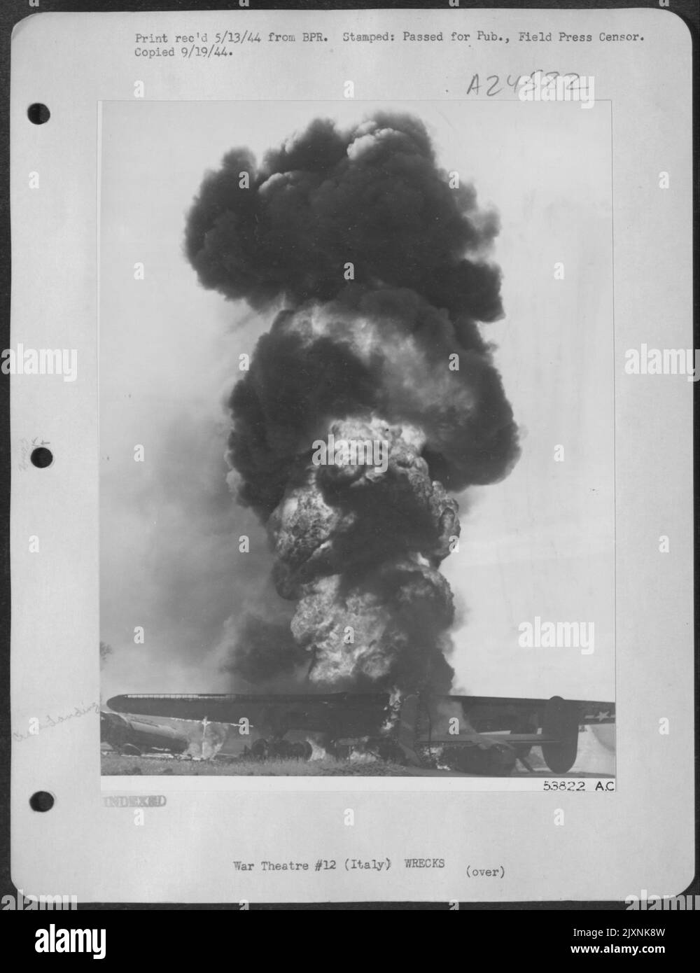 An ominious pillar of smoke and flame rises from the remains of this ...