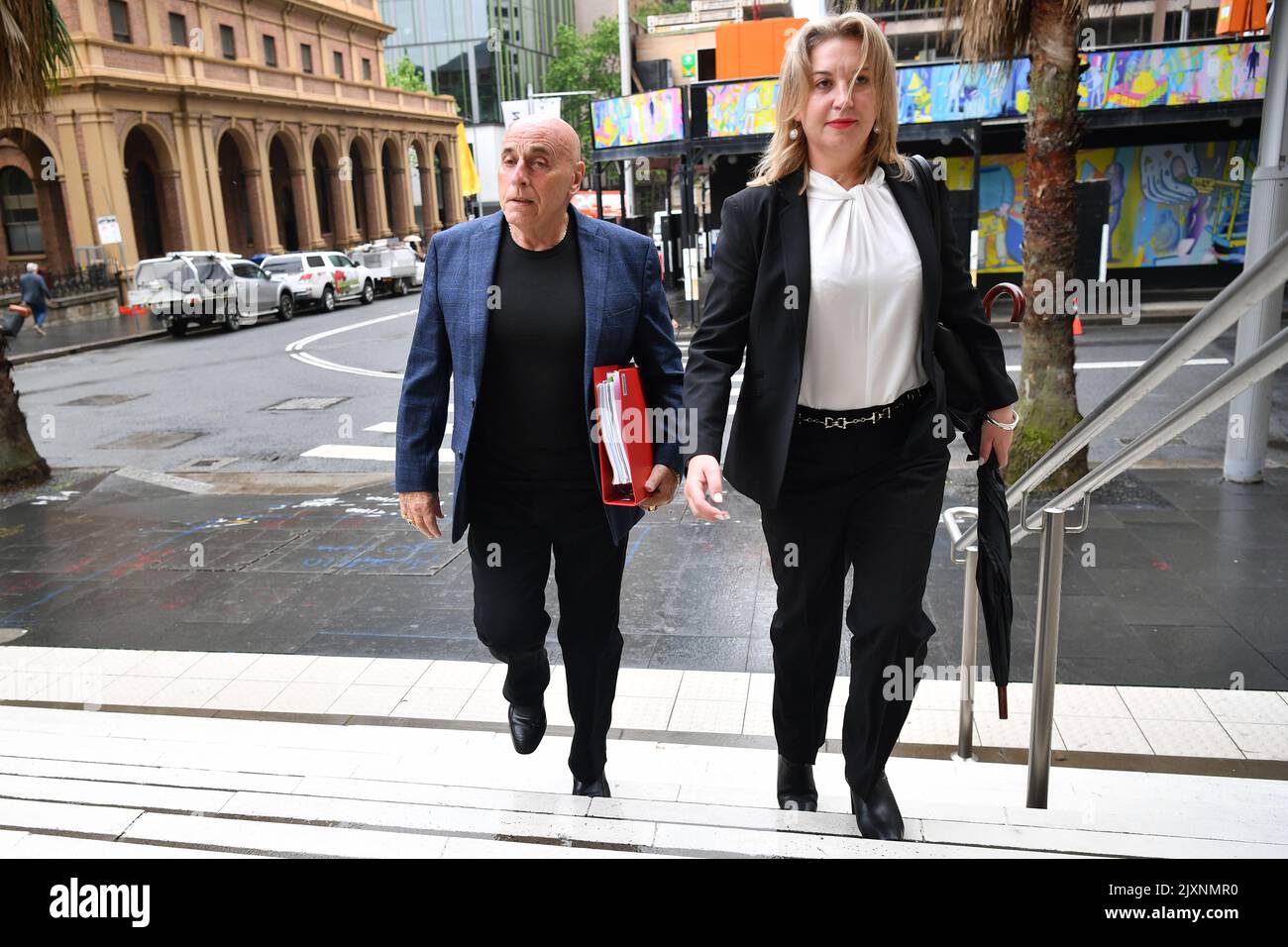 Tom Domican (left) arrives at the Supreme Court in Sydney, Wednesday ...