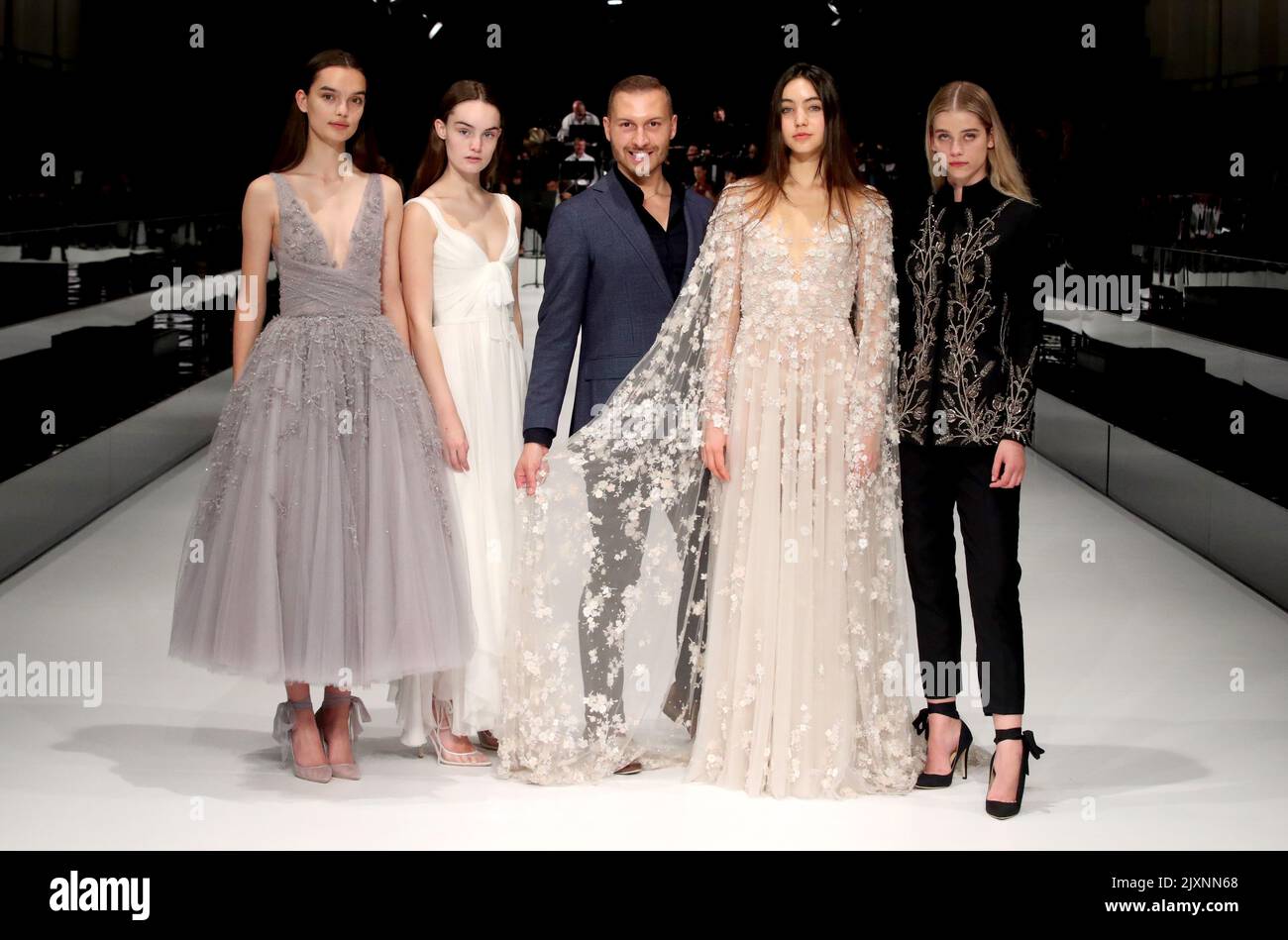 (L-R) Models Beck, Hannah, Paolo Sebastian designer Paul Vasileff ...