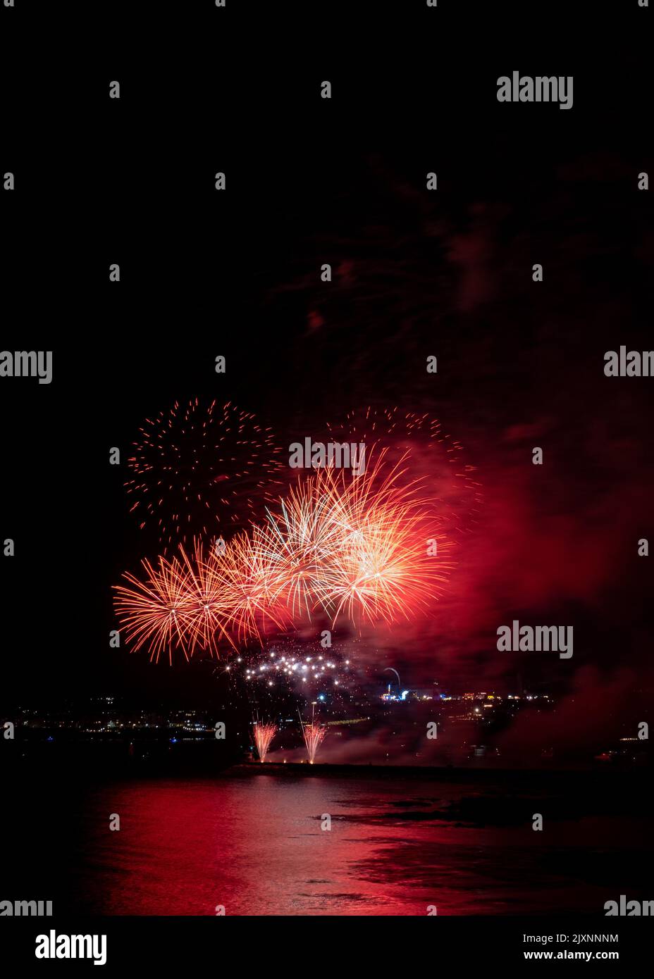A display of colorful fireworks in dark sky during British firework ...