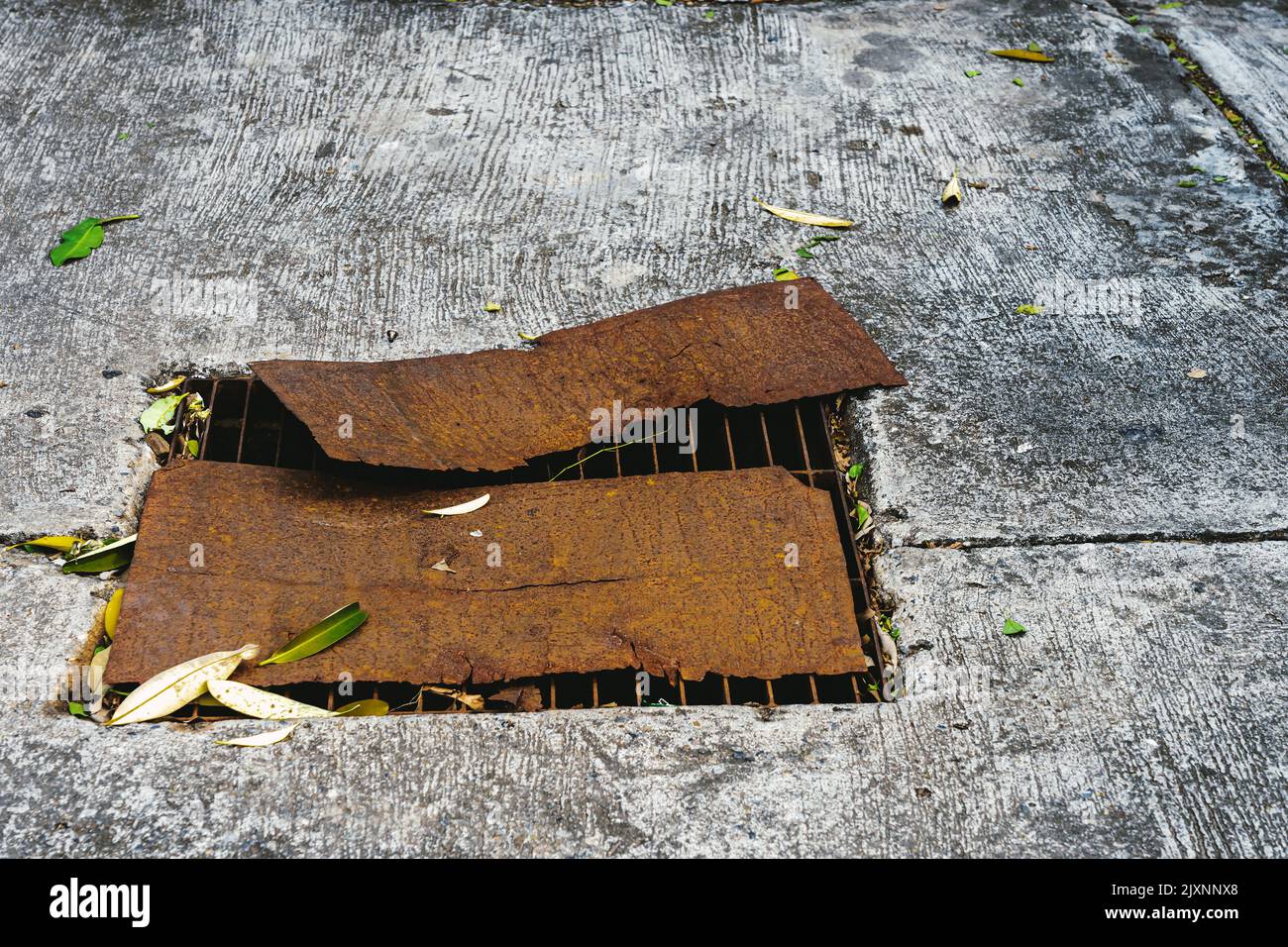 Top view of old rusted metal plate was used to cover the broken steel ...