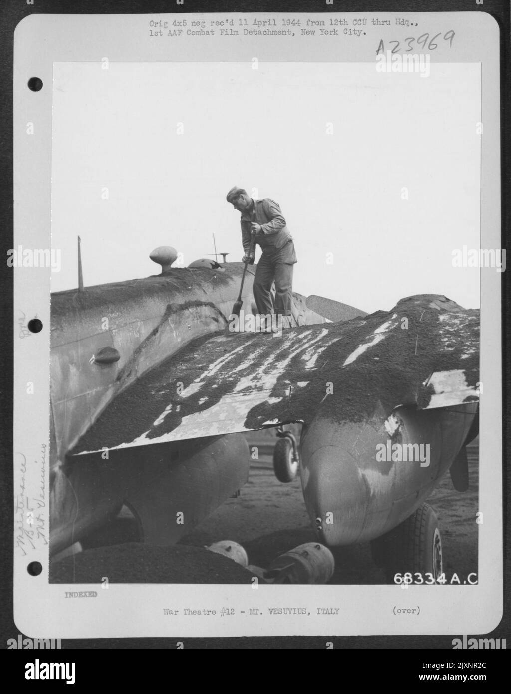 Crew Member Cleaning The Ashes And Cinders Off The Wing Of A North ...