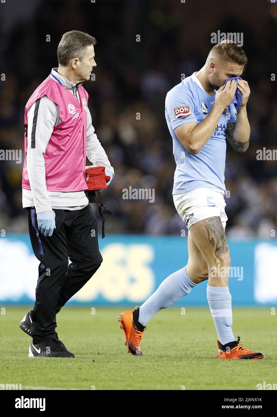 Bart Schenkeveld of City (right) receives medical attention during the ...