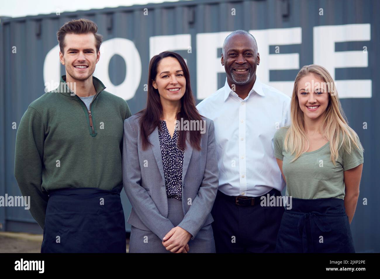 Portrait Of Multi-Cultural Freight Haulage Team Standing By Shipping ...