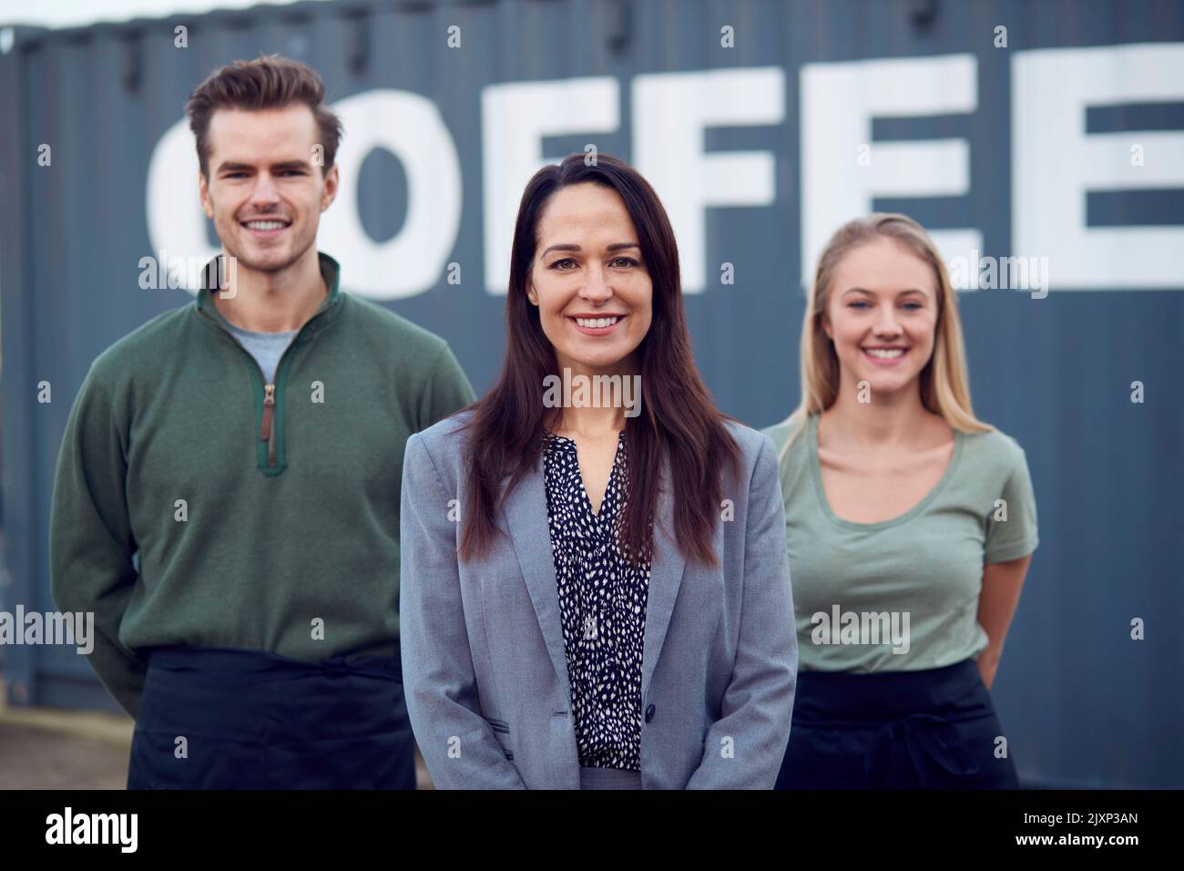 Portrait Of Freight Haulage Team Standing By Shipping Container Stock ...
