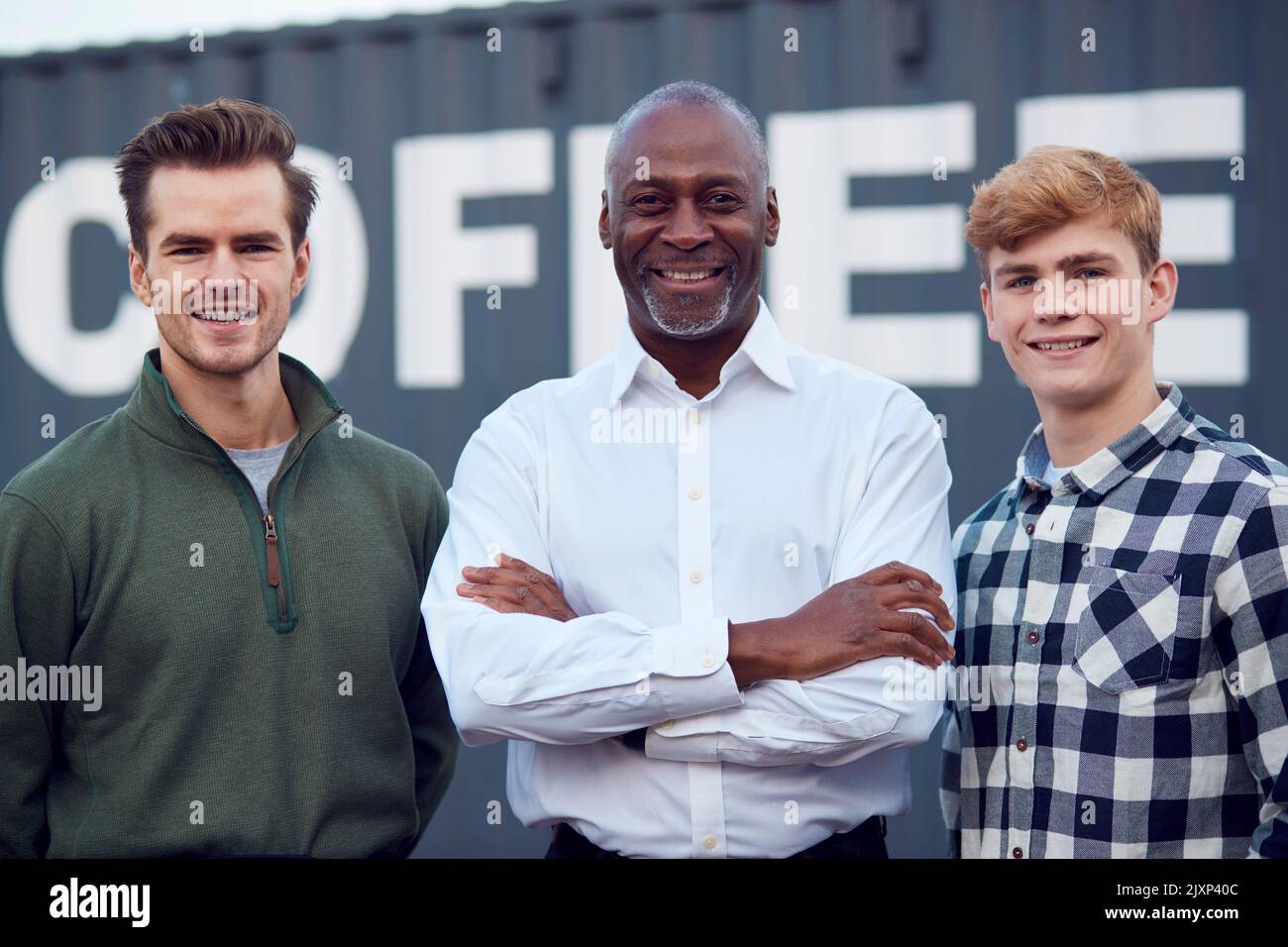 Portrait Of Male Multi-Cultural Freight Haulage Team Standing By ...