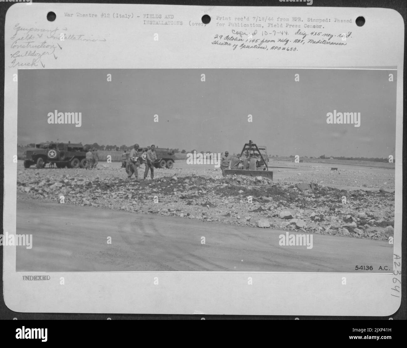 Engineers set to work with a bulldozer and other equipment to ready an ...