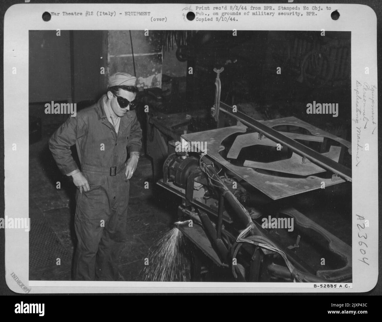 Standing back and watching "her" work is M/Sgt. Walter M. Bakula, North ...