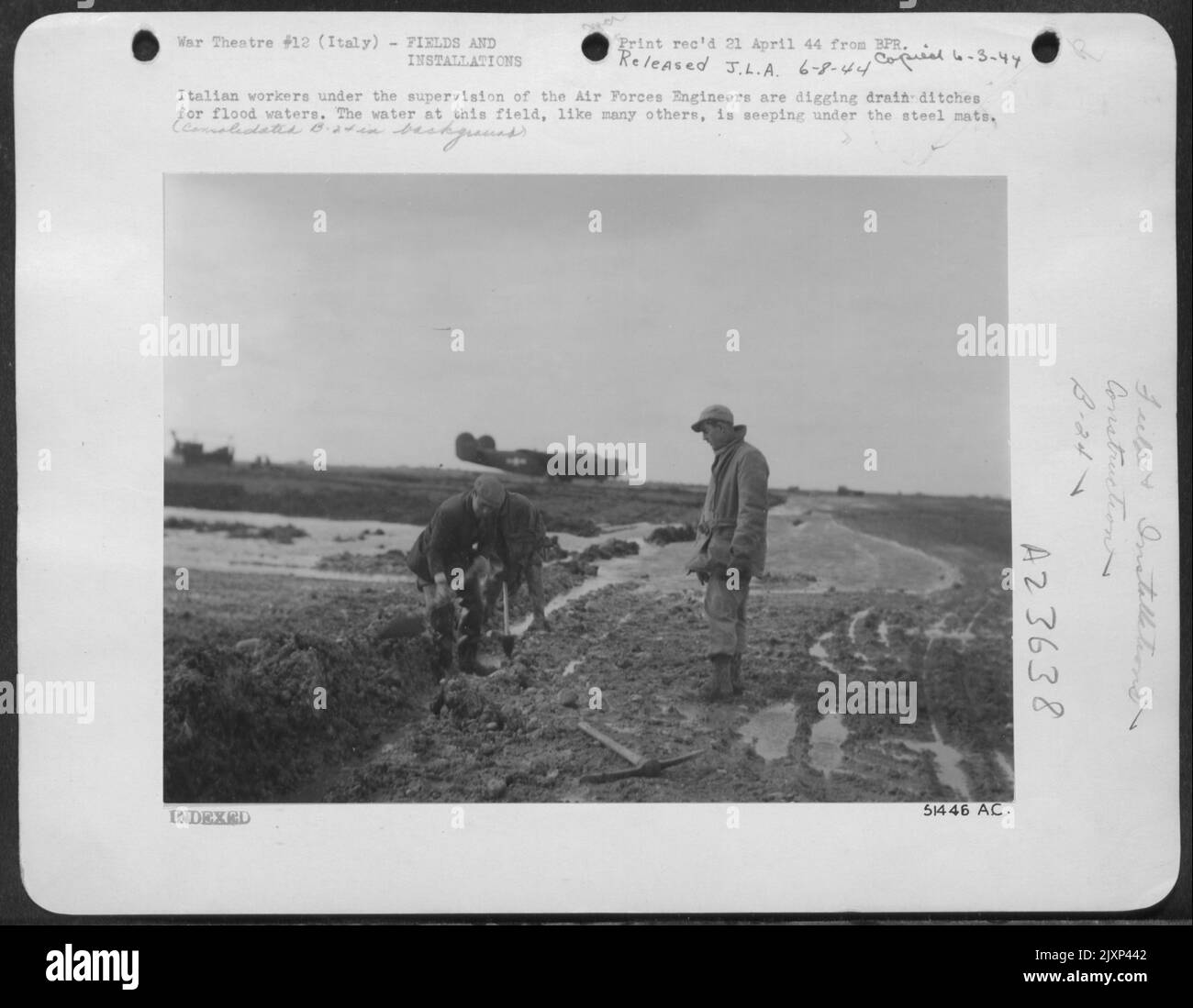 Italian workers under the supervision of the Air Forces Engineers are ...