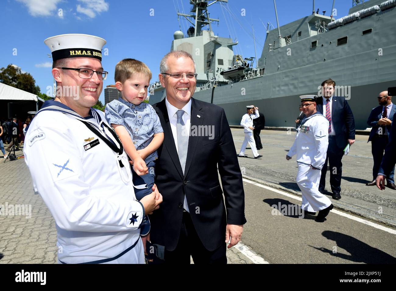 Prime Minister Scott Morrison poses for a photograph with a Navy member ...