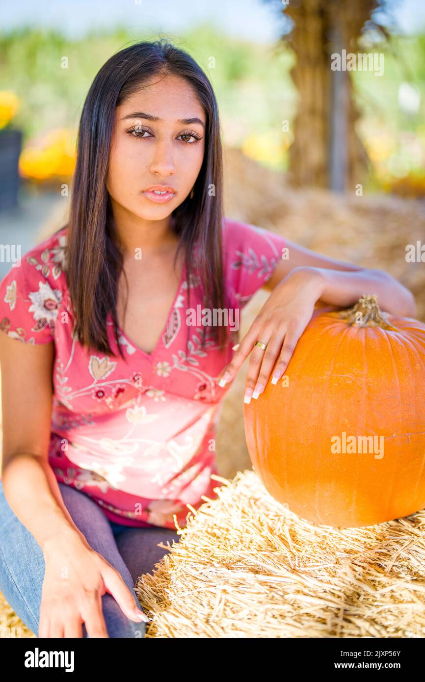 Fall Celebration Portrait of Young Asian Woman Seated on a Straw Chair ...