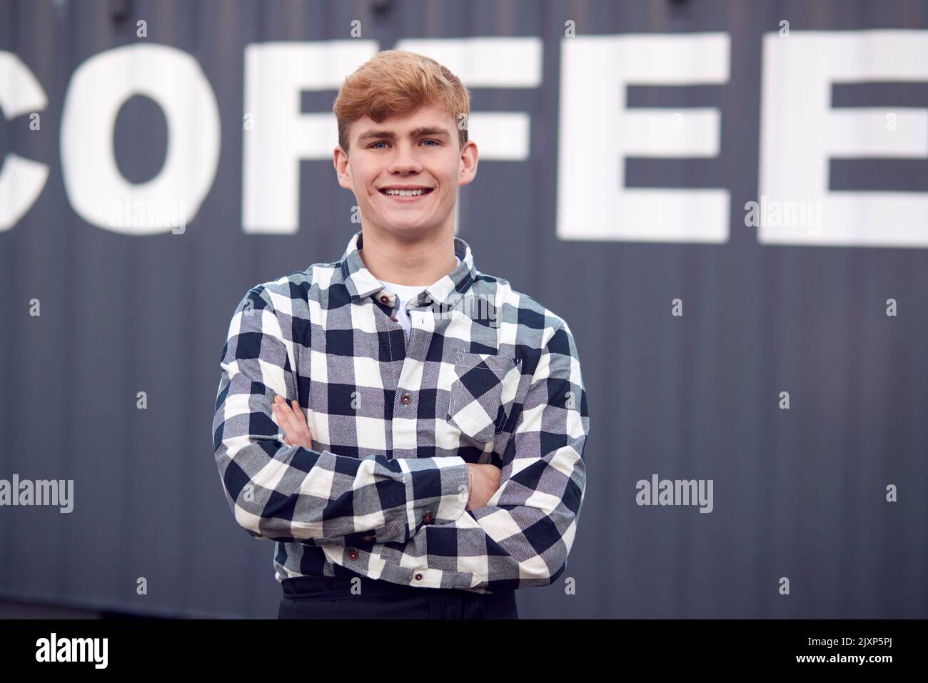 Portrait Of Male Intern At Freight Haulage Business Standing By ...