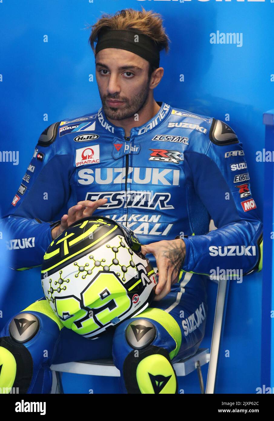 Grand Prix rider Andrea Iannone of Italy for Team Suzuki Ecstar waits ...