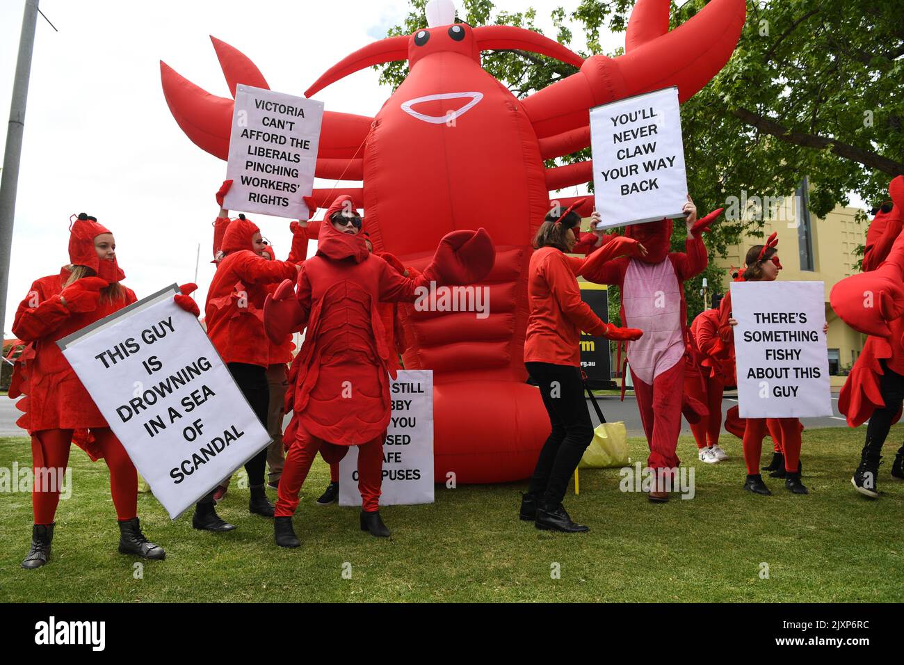 Protesters are seen outside the Victorian Liberal Party's official ...