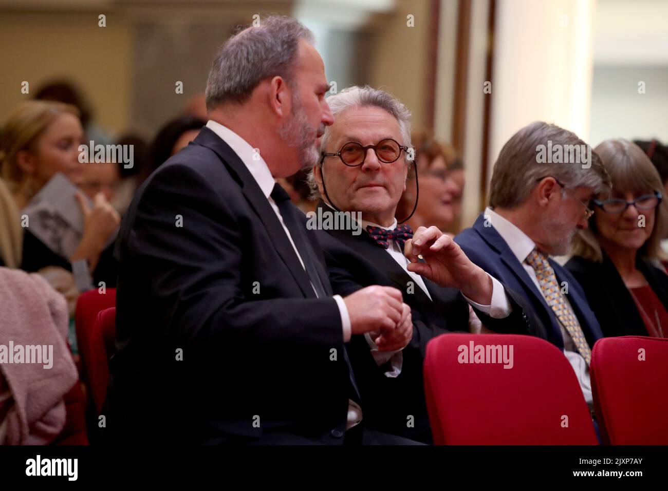 Australian filmmaker George Miller (right) is seen at the memorial ...