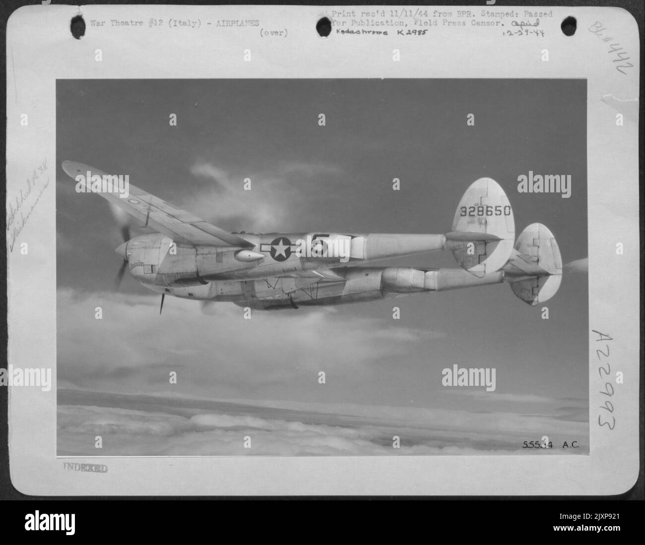 One of the many. High in the clouds over Italy, flys this Lockheed P-38 ...