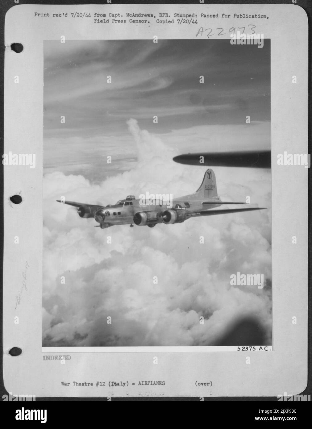 This silver Boeing B-17 Flying Fortress of the 15th AAF rides serenely ...