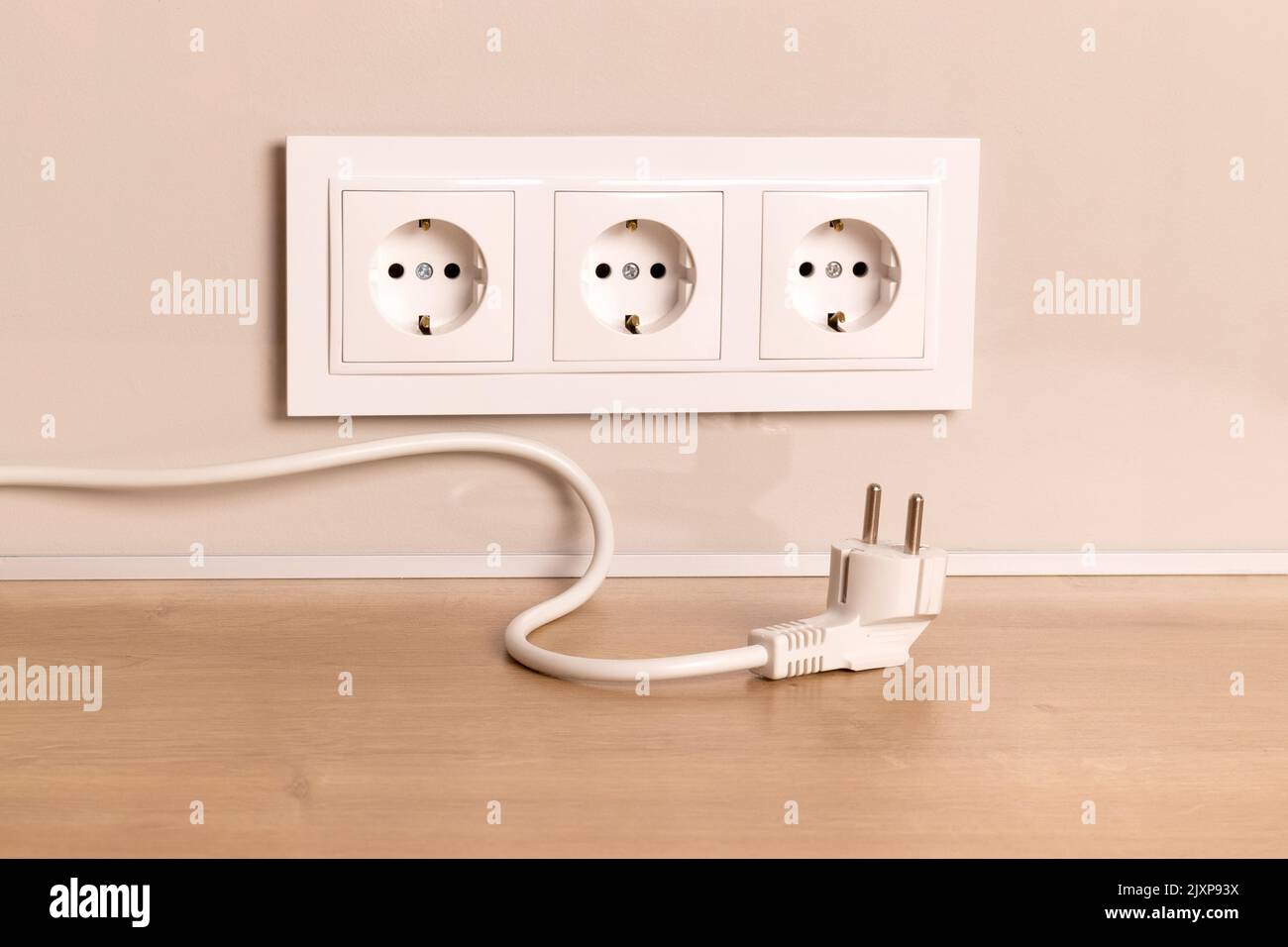 Power cord cable unplugged with group of white european electrical ...