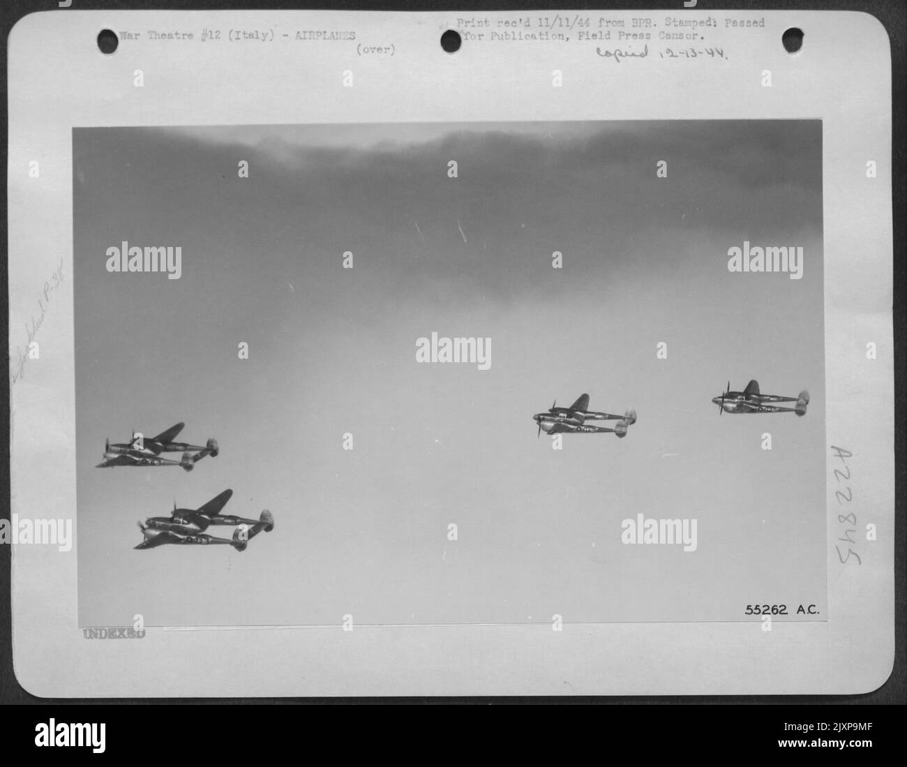 Lockheed P-38 Lightnings of a Fighter Group of the 15th Air Force fly ...