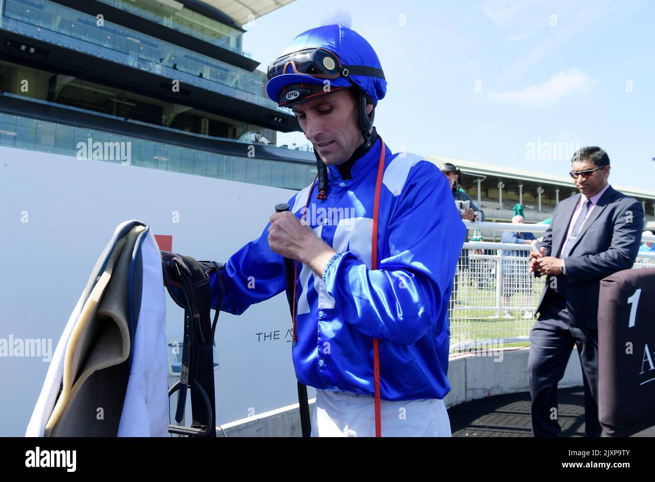 Jockey Tye England is seen in the mounting yard after riding Miss ...