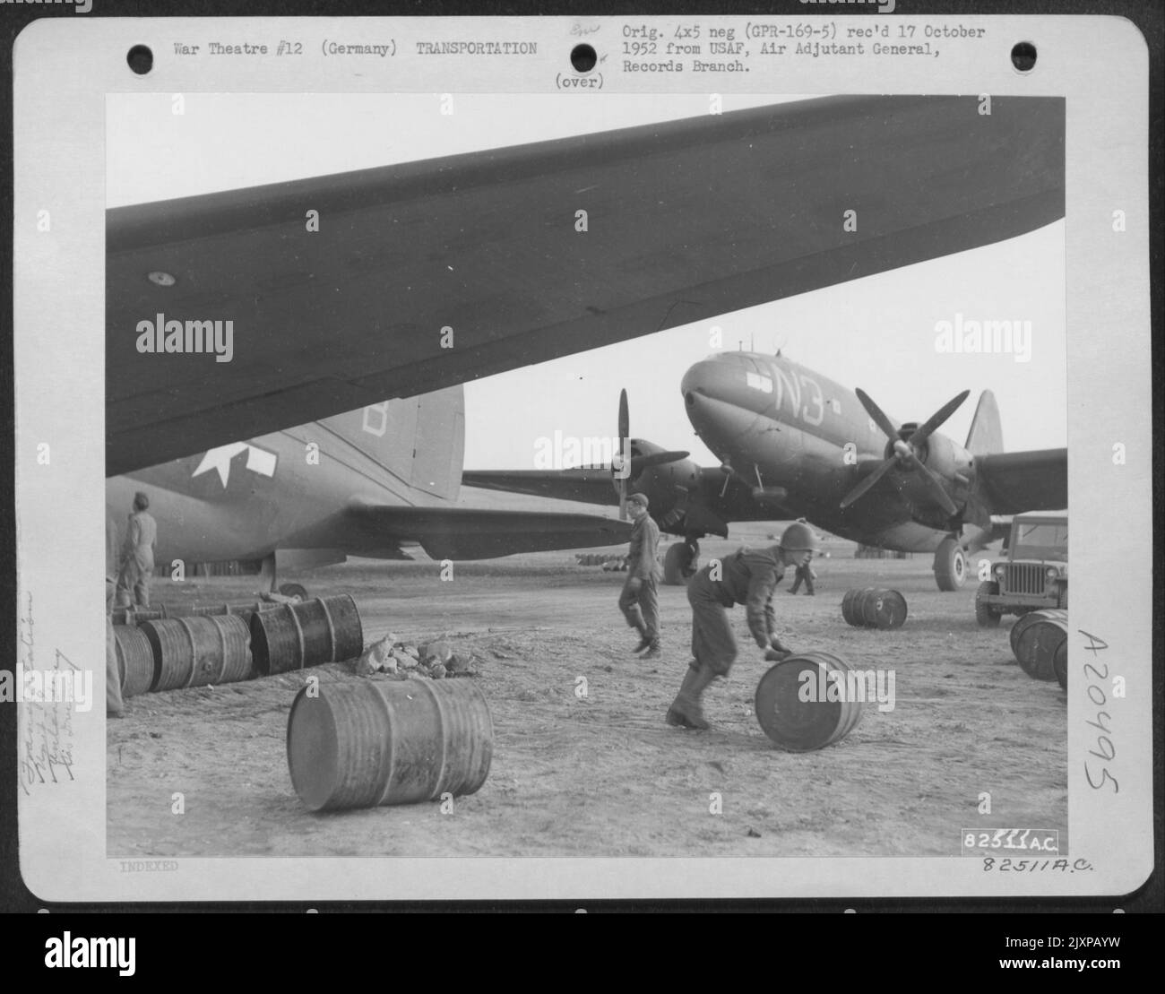 Members Of The 9Th Troop Carrier Command Unload 40 Gallons Drums Of ...