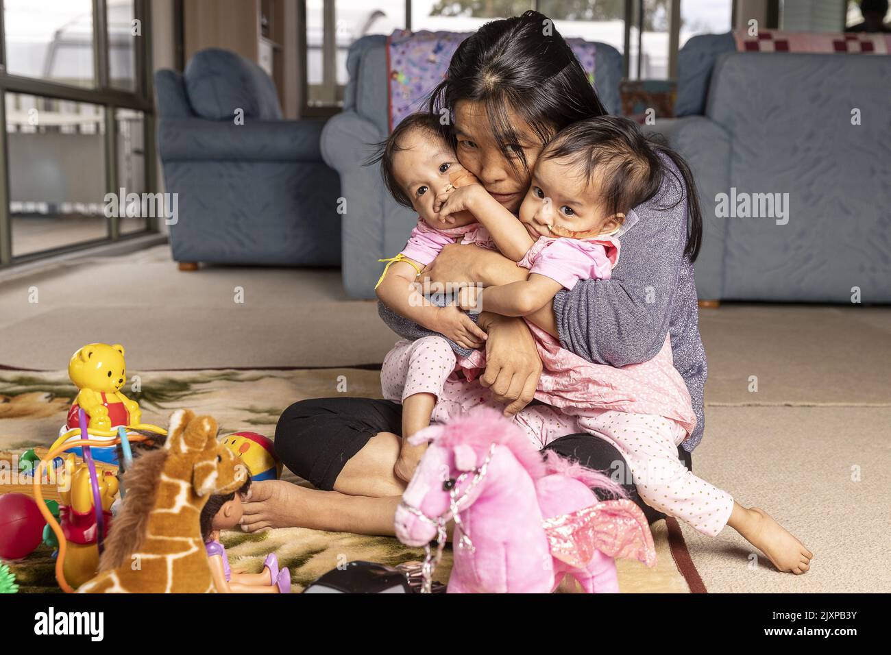 Bhumchu Zangmo is seen holding her conjoined twins Nima and Dawa at ...