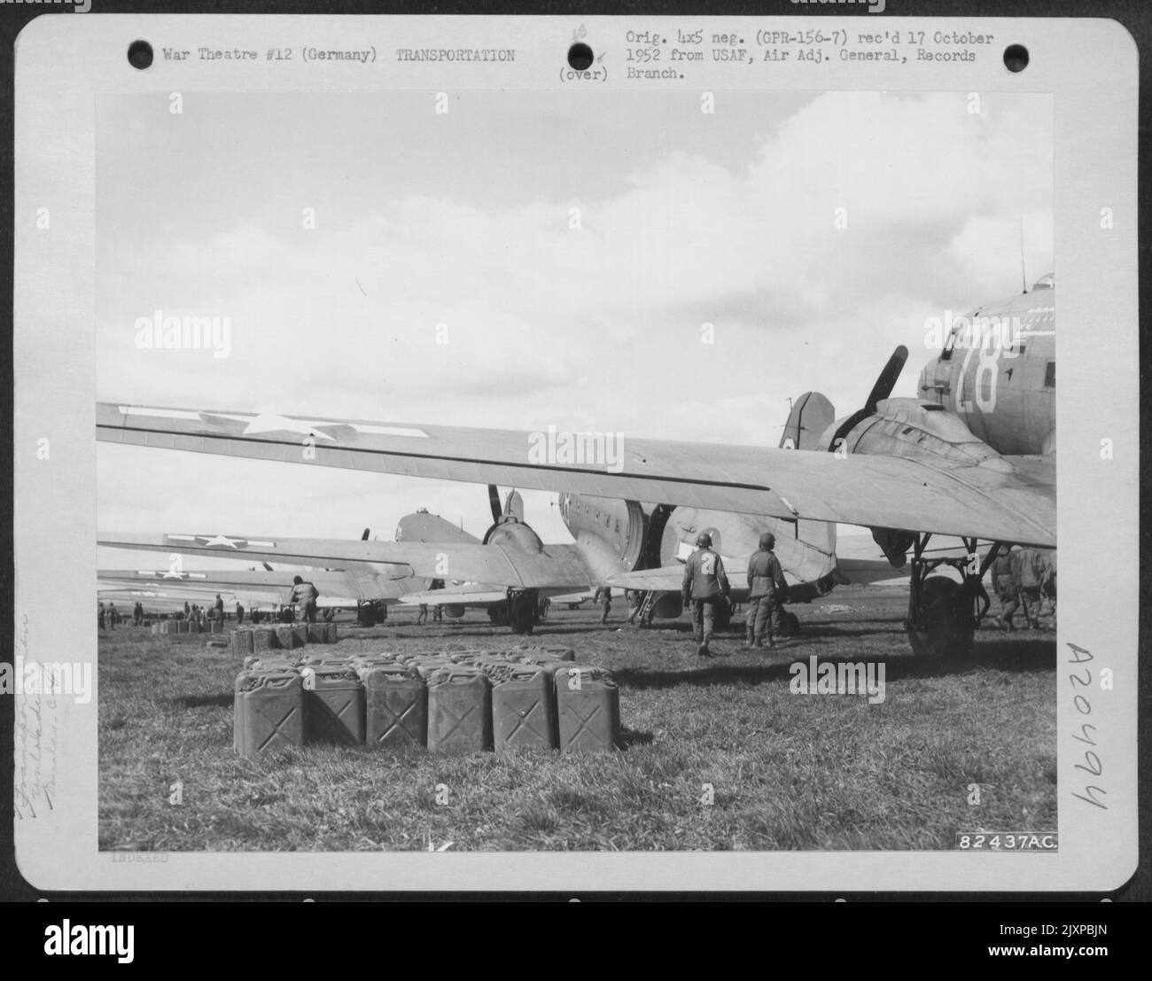 American And British Pows Unload Cans Of Gasoline From A Douglas C-47 ...