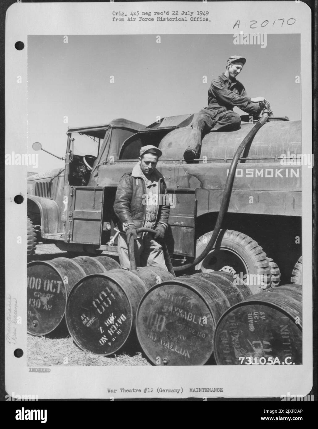 Enlisted Men Transfer Gasoline From Drums Into Fuel Trucks At An ...