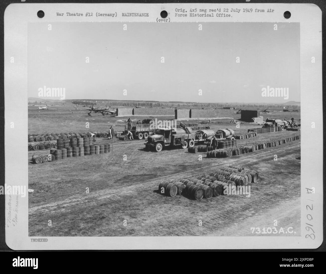 Enlisted Men Transfer Gasoline From Drums Into Fuel Trucks At An ...