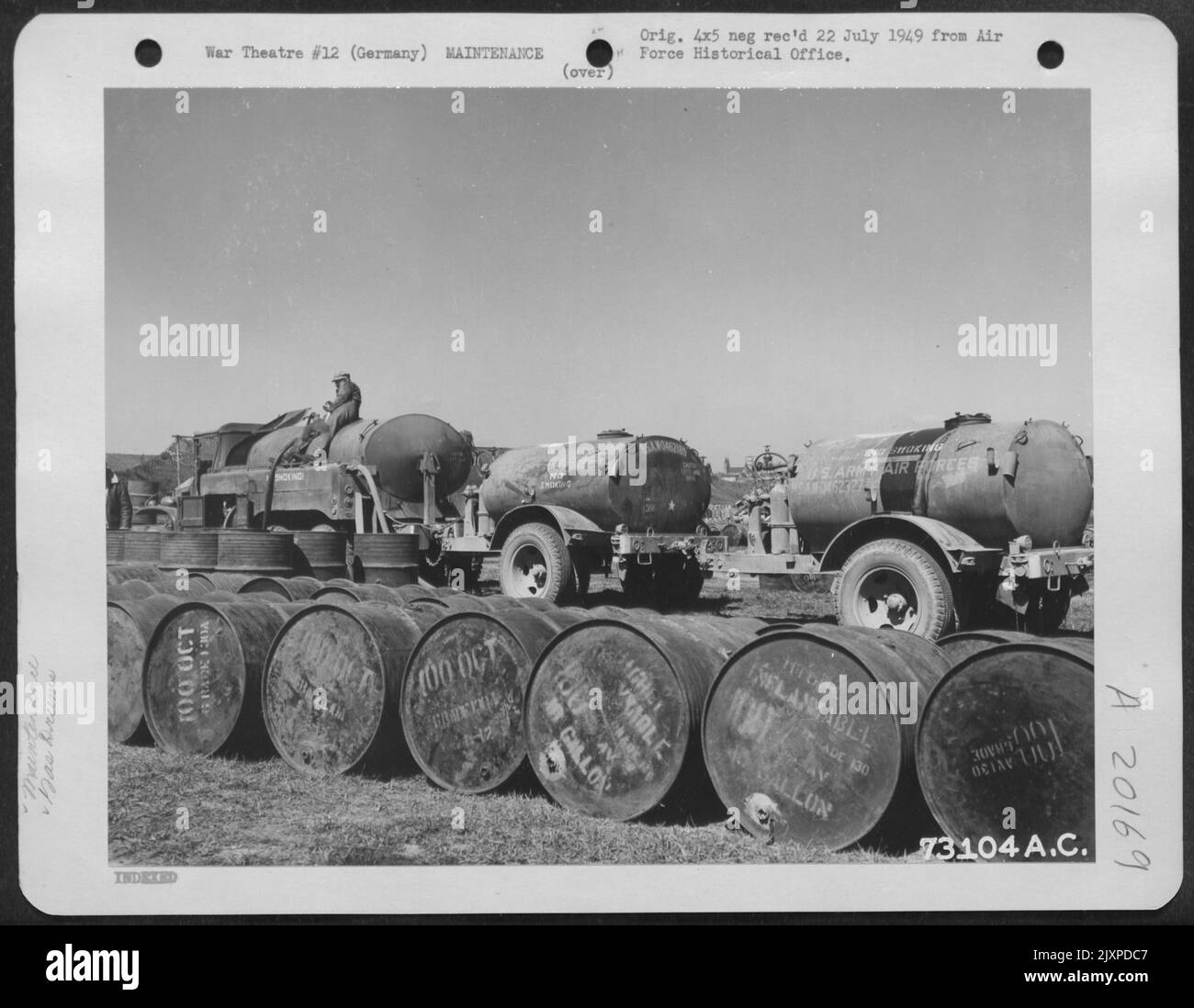 Enlisted Men Transfer Gasoline From Drums Into Fuel Trucks At An ...